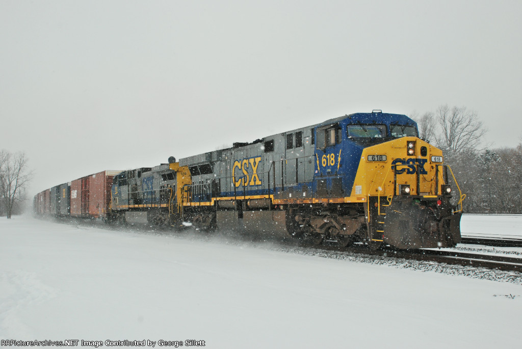 A CSX AC60CW leads another eastbound mixer.